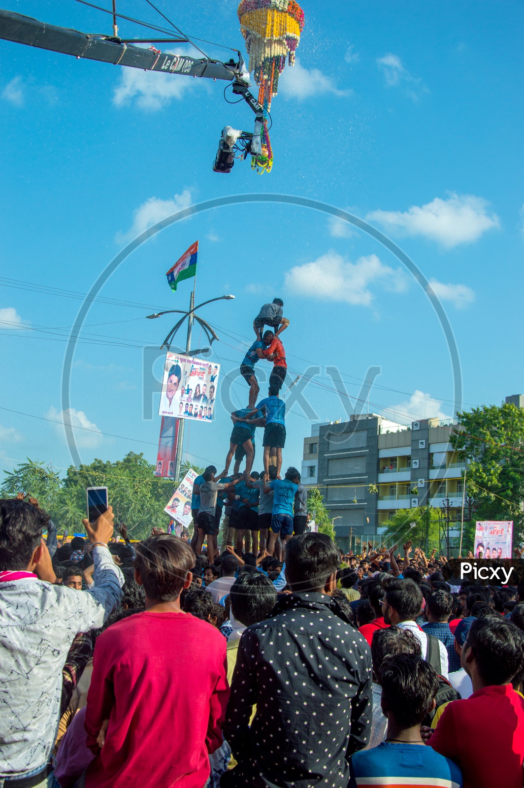 Image of Crowd Of Young Indian People Enjoying Making Human Pyramid At ...