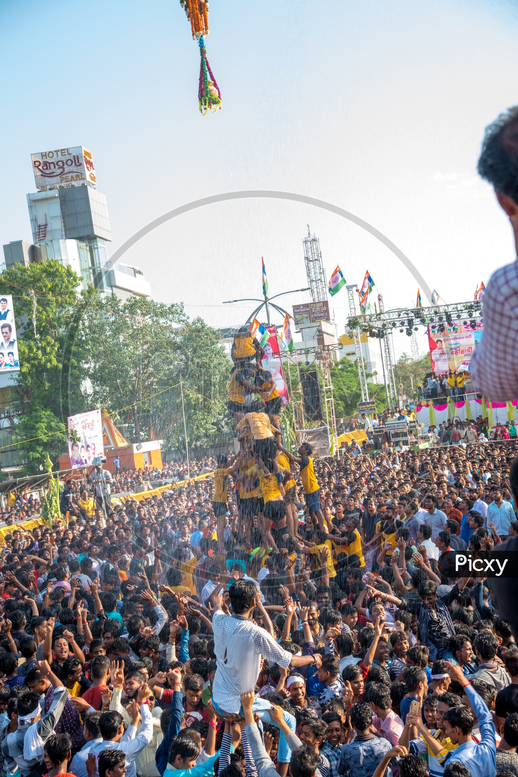 Image of Crowd Of Young Indian People Enjoying Making Human Pyramid At ...