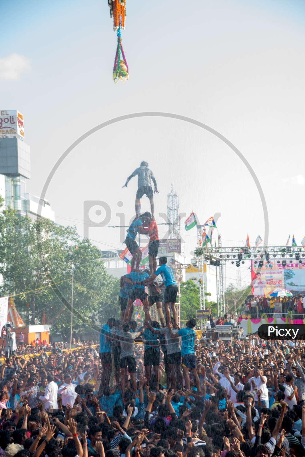 Image of Crowd Of Young Indian People Enjoying Making Human Pyramid At ...