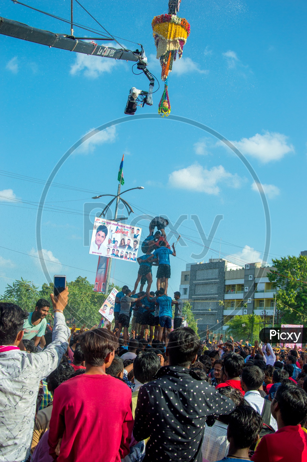 Image of Crowd Of Young Indian People Enjoying Making Human Pyramid At ...
