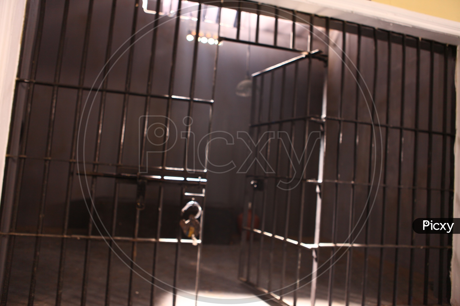 Image of iron Grill or bars Of a Jail Gate-HW585366-Picxy