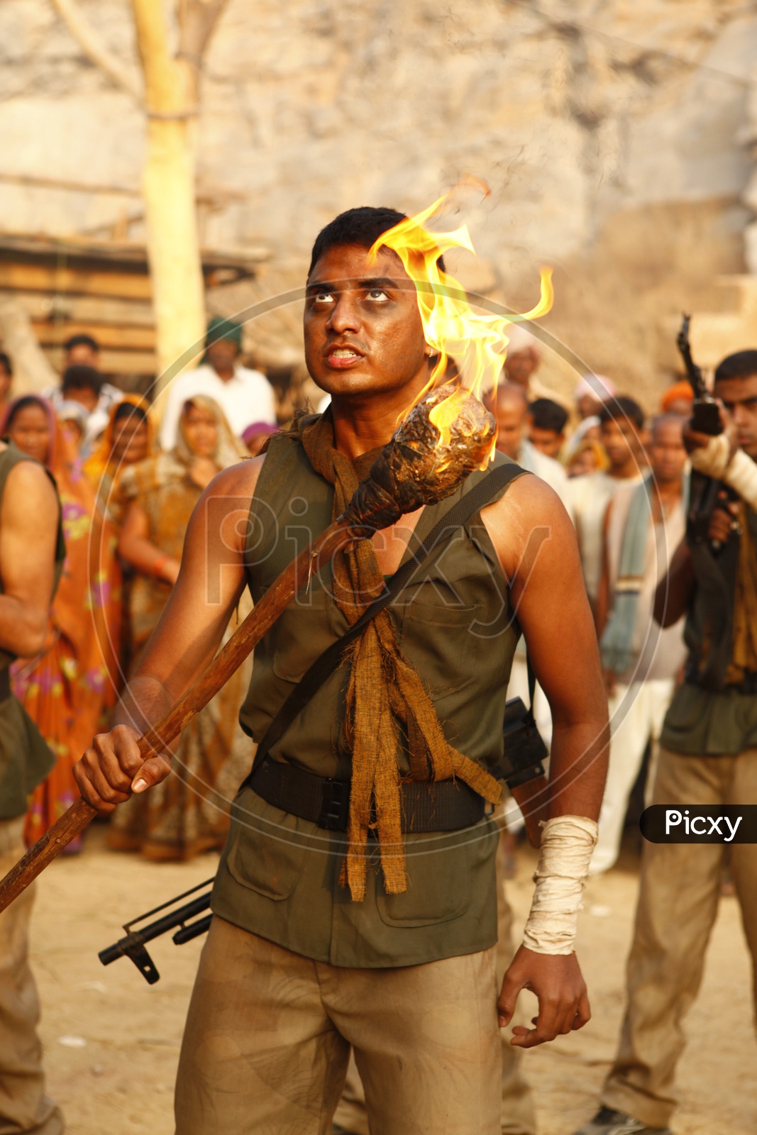 Image of An Aggressive Young Man With a Fire Stick in Hand-SN577791-Picxy