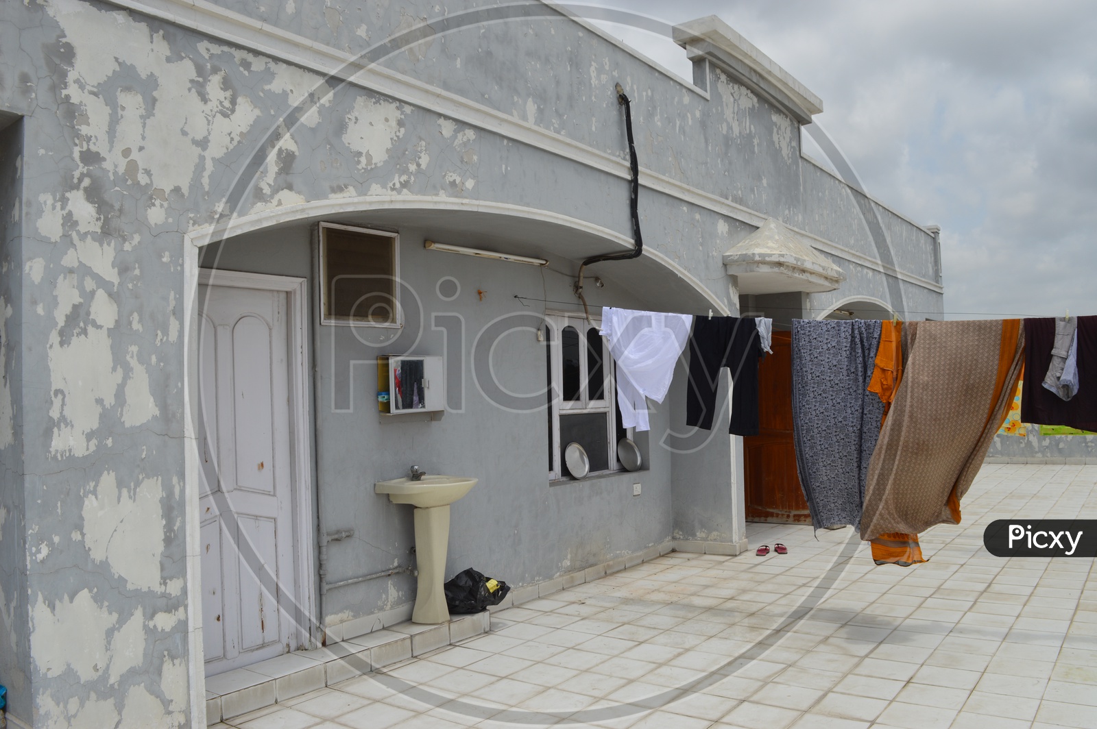 Image of Clothes Drying on House Terrace-DA772069-Picxy