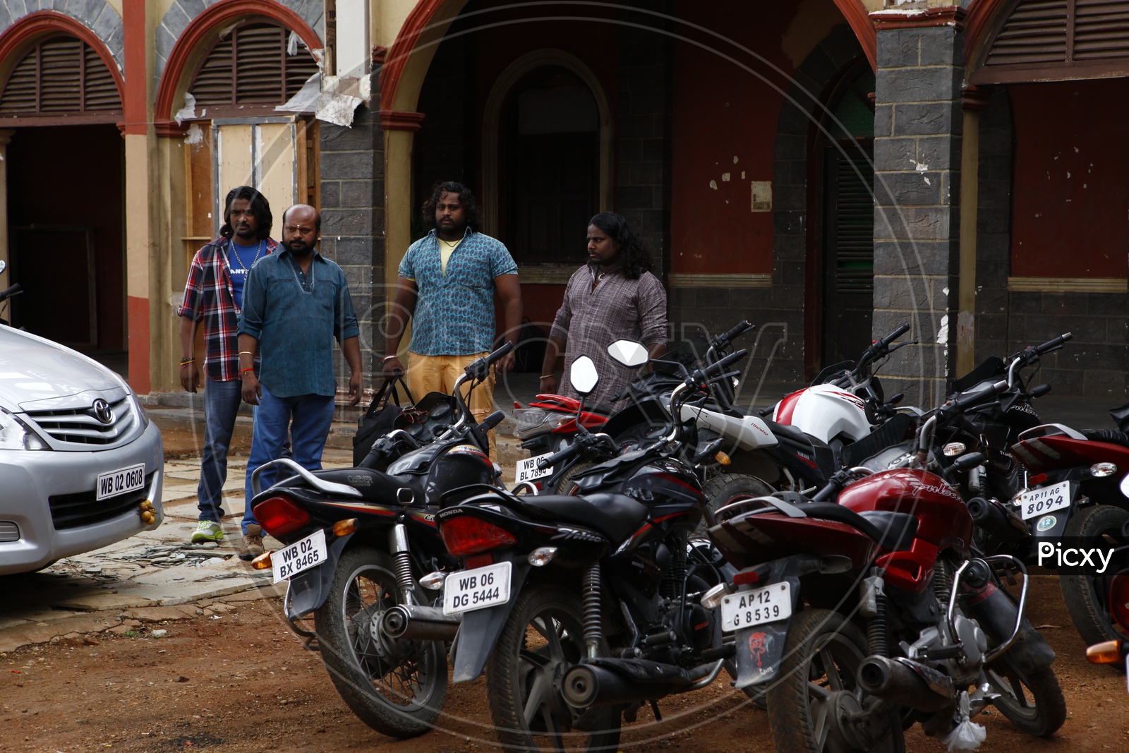Image of Indian male men Goons Standing at Bike Parking-YK353561-Picxy