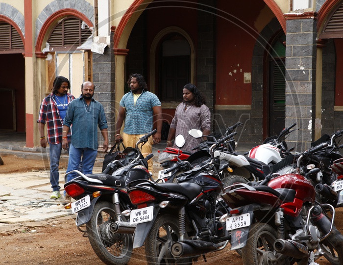 Image of Indian male men Goons Standing at Bike Parking-YK353561-Picxy