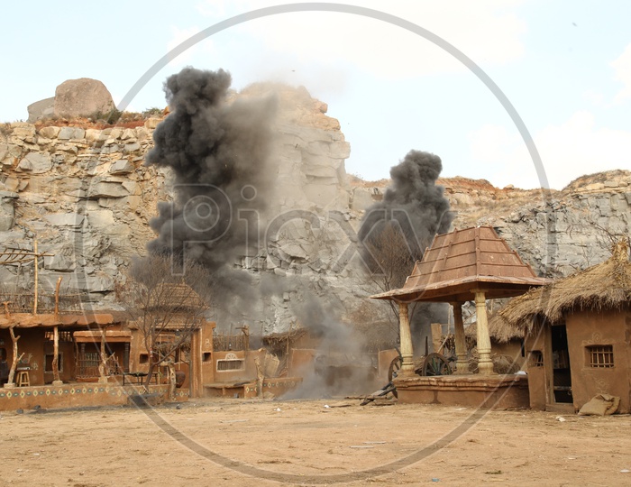 Image of Fire Accident mishap bomb blast in a rural village with huts ...