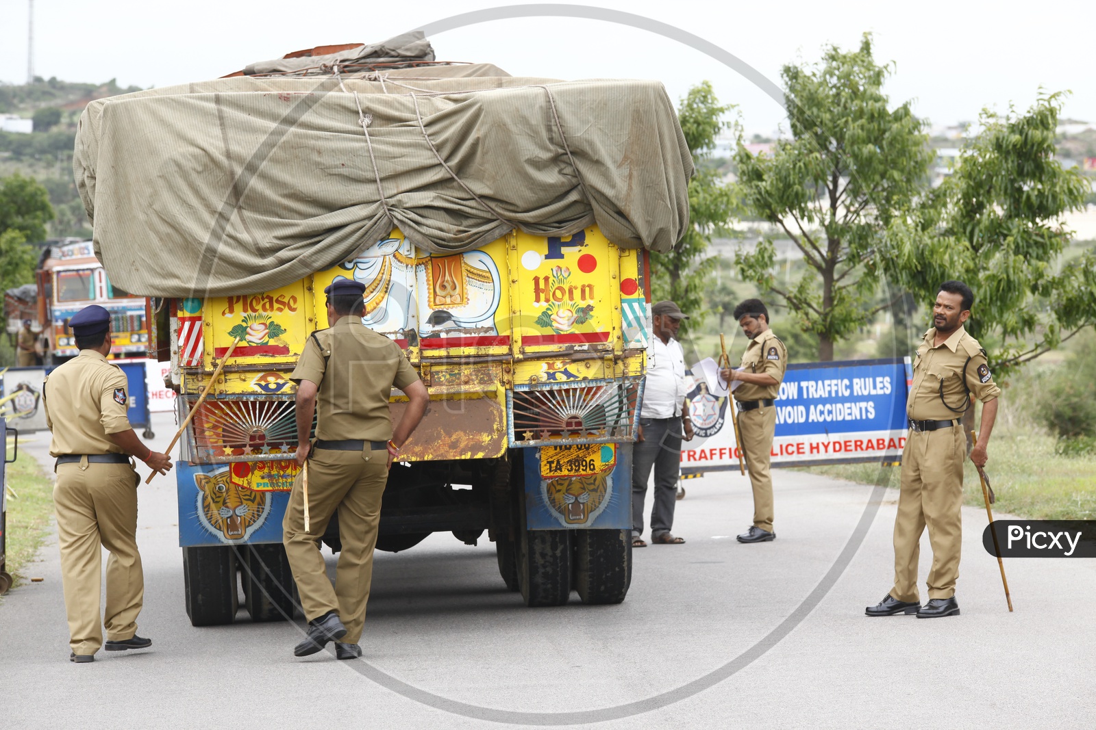 Image of Police Man Checking Trucks lorries with Barricades at Highway ...