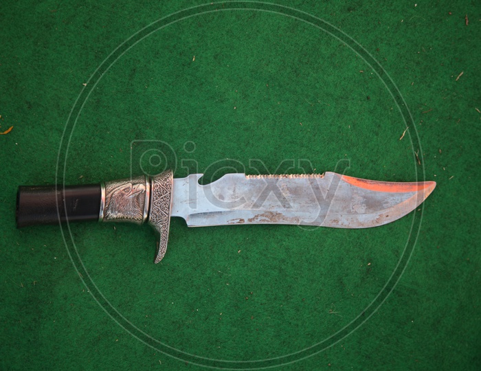 Image of Designed Knife Chaku on an Isolated Green isolated Background ...