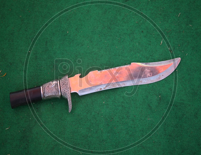 Image of Designed Knife Chaku on an Isolated Green isolated Background ...