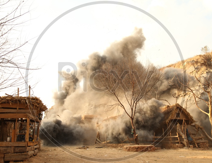 Image of Bomb Blast In a Rural Village With Huts in Air-BG496032-Picxy