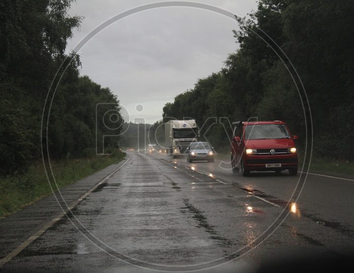 Image of Vehicles on Road while raining-JZ491924-Picxy