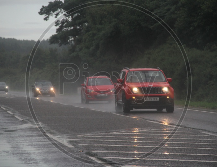 Image of Cars travelling while raining on Highway-PS917396-Picxy