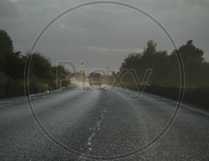 Image of Vehicles on Road while raining-JZ491924-Picxy