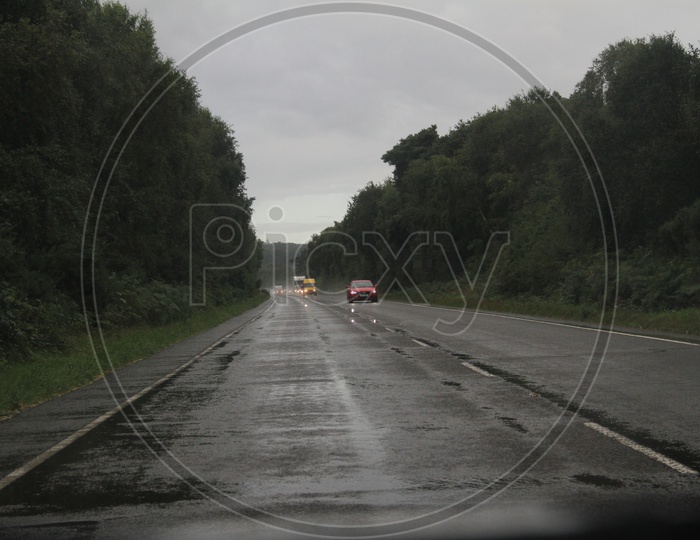 Image of Vehicles on Road while raining-JZ491924-Picxy