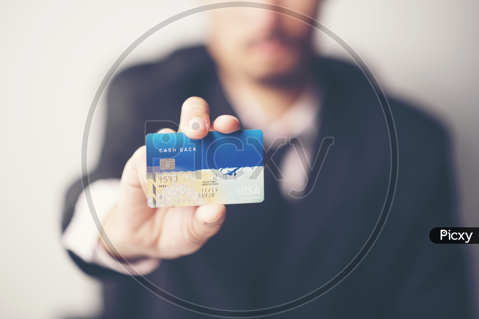 Image of Close up of male hand showing credit or debit card, making ...