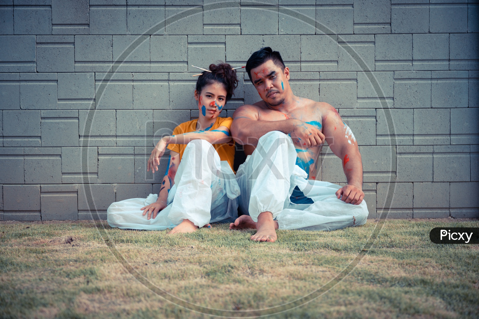 Image of Affectionate Lovely Couple Celebrating love by Painting Their ...