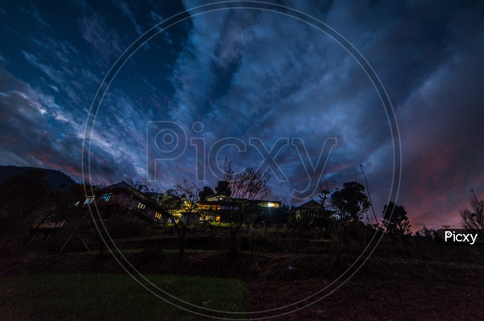 Image of Night View of Houses in Village with Clouds in Sky-NX091869-Picxy