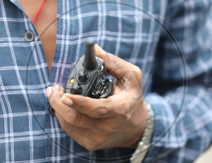 Image of A Walkie Talkie in a man's hand-SI816243-Picxy