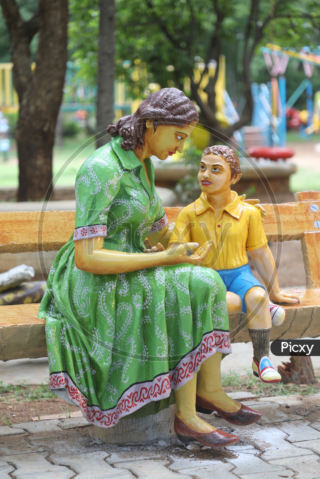 Image of Children Siblings Sister and Younger Brother on a Park bench ...