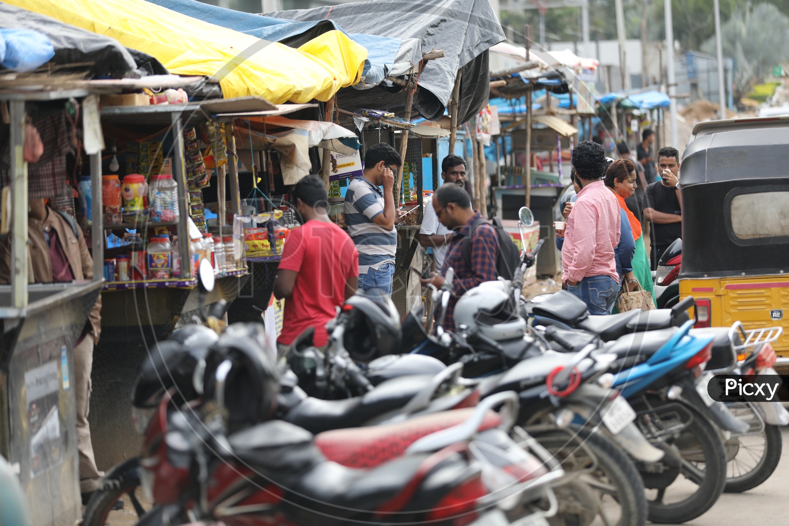 Image of Bikes parked along the street vendor shops-CR586442-Picxy