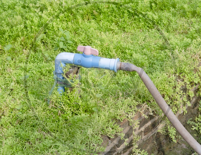 Image of PVC Pipe in a Agricultural Feild With a Plug Valve-DD766925-Picxy