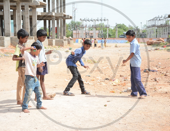 Image of Indian Children Playing with Spinning Top Or Bongaram-RA106309 ...