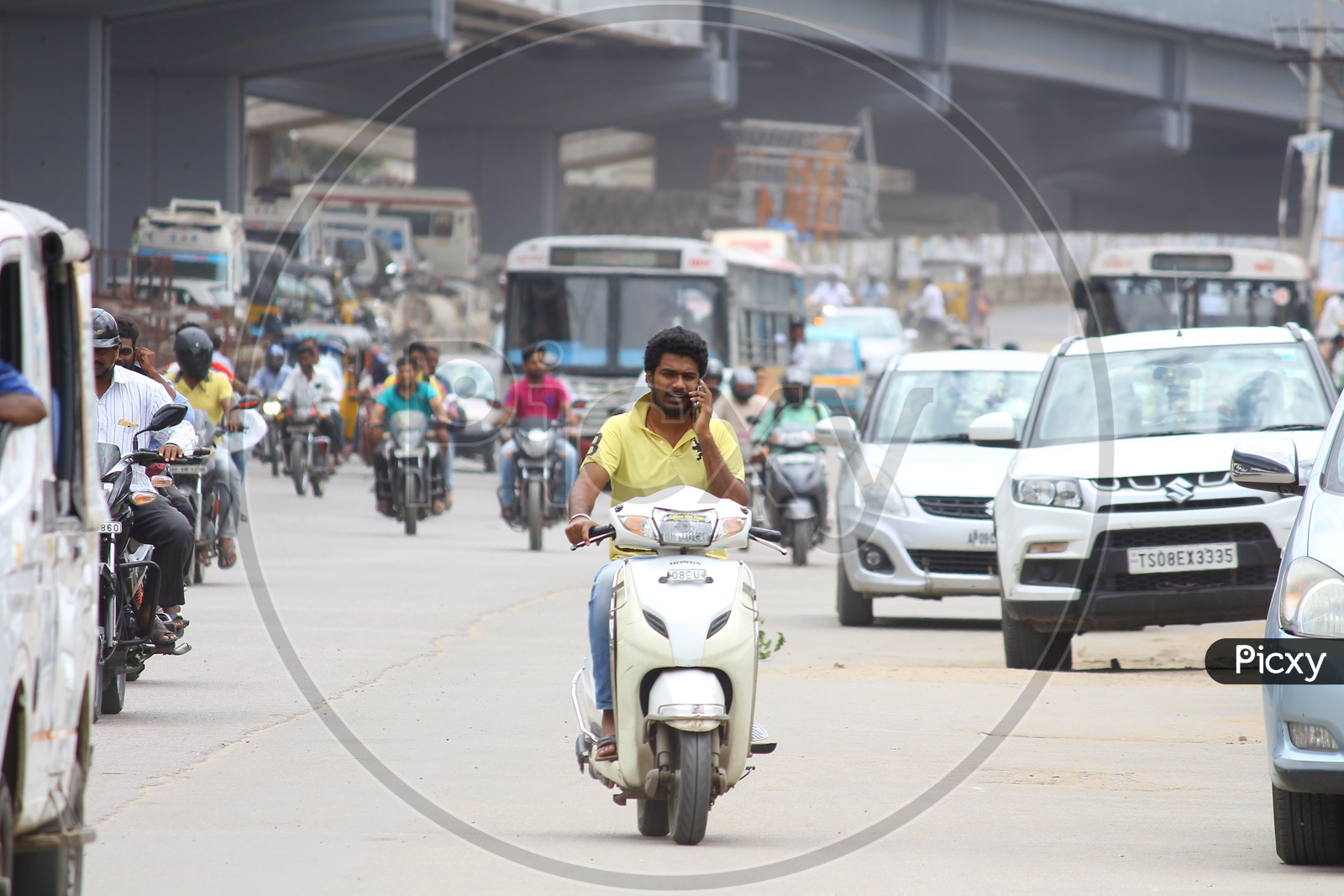 Image of Traffic Rules Violation By Using Cellphone While Commuting in Bike on Hyderabad City ...