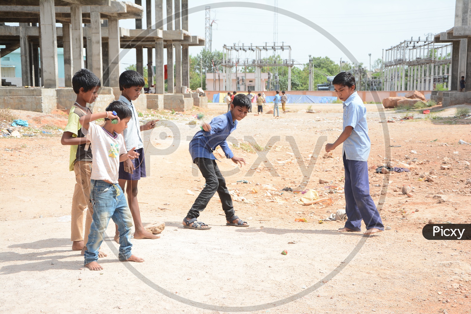 Image of Indian Children Playing with Spinning Top Or Bongaram-QJ973521 ...