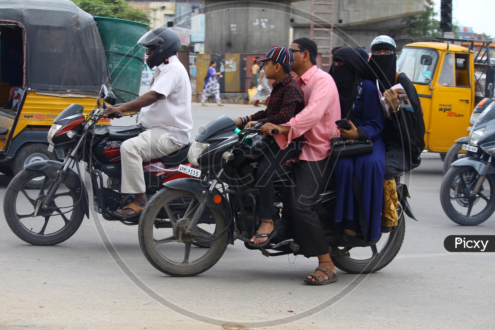 Image of City Commuter Traffic Rules Violation With Triple Riding in ...