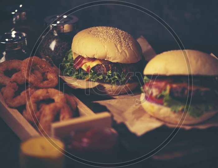 Image of A delicious grilled Angus burger with cheese, lettuce, and ...