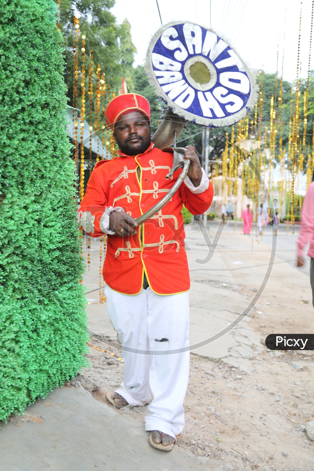 Image of Indian Orchestra man carrying a music instrument-BN437643-Picxy