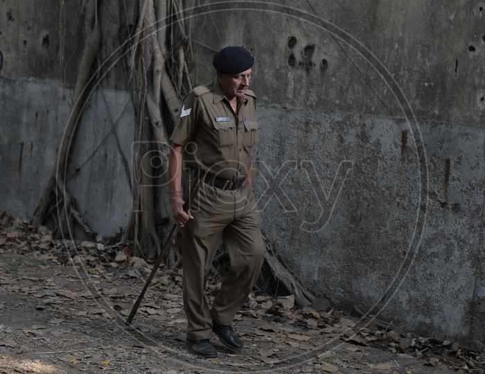 Image of Indian Watchman walking-UX445672-Picxy
