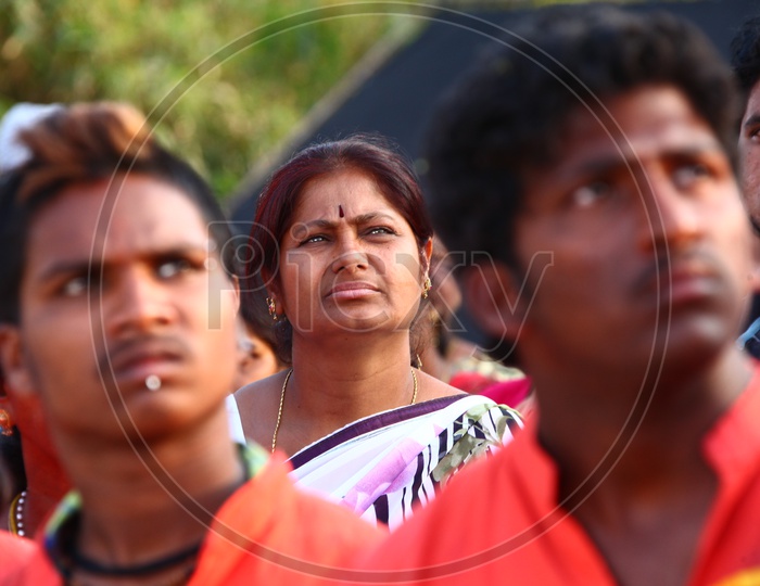 Image of Indian Woman amidst the men wearing bindi-HH954048-Picxy