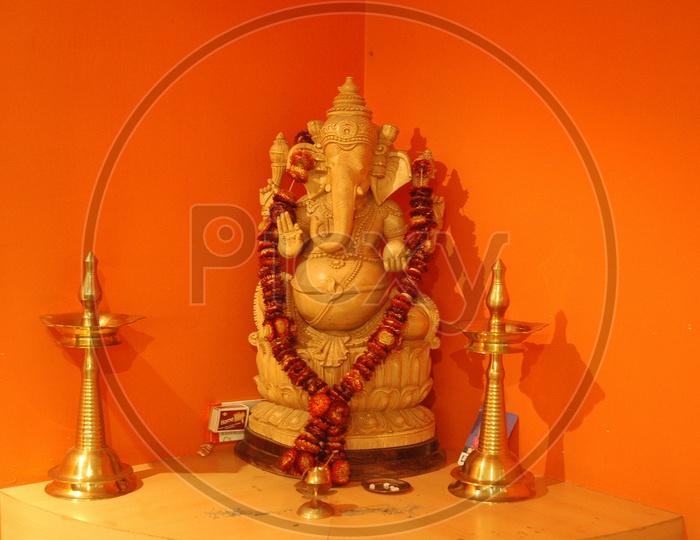 Image of Lord Ganesh idol With Pooja Dia In a House-KF256129-Picxy