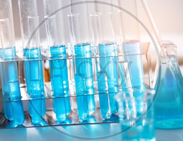 Image of Glassware and blue liquid equipment in chemical laboratories ...