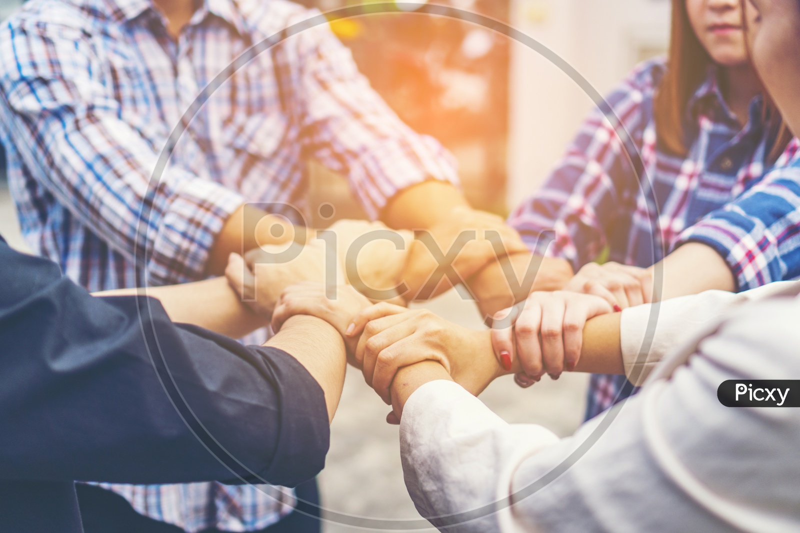 Image of A Team holding hands taking oath-GU130025-Picxy