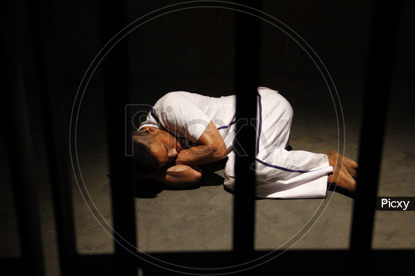 Image of Indian Male Prisoner in uniform in a Jail Sleeping on Floor ...