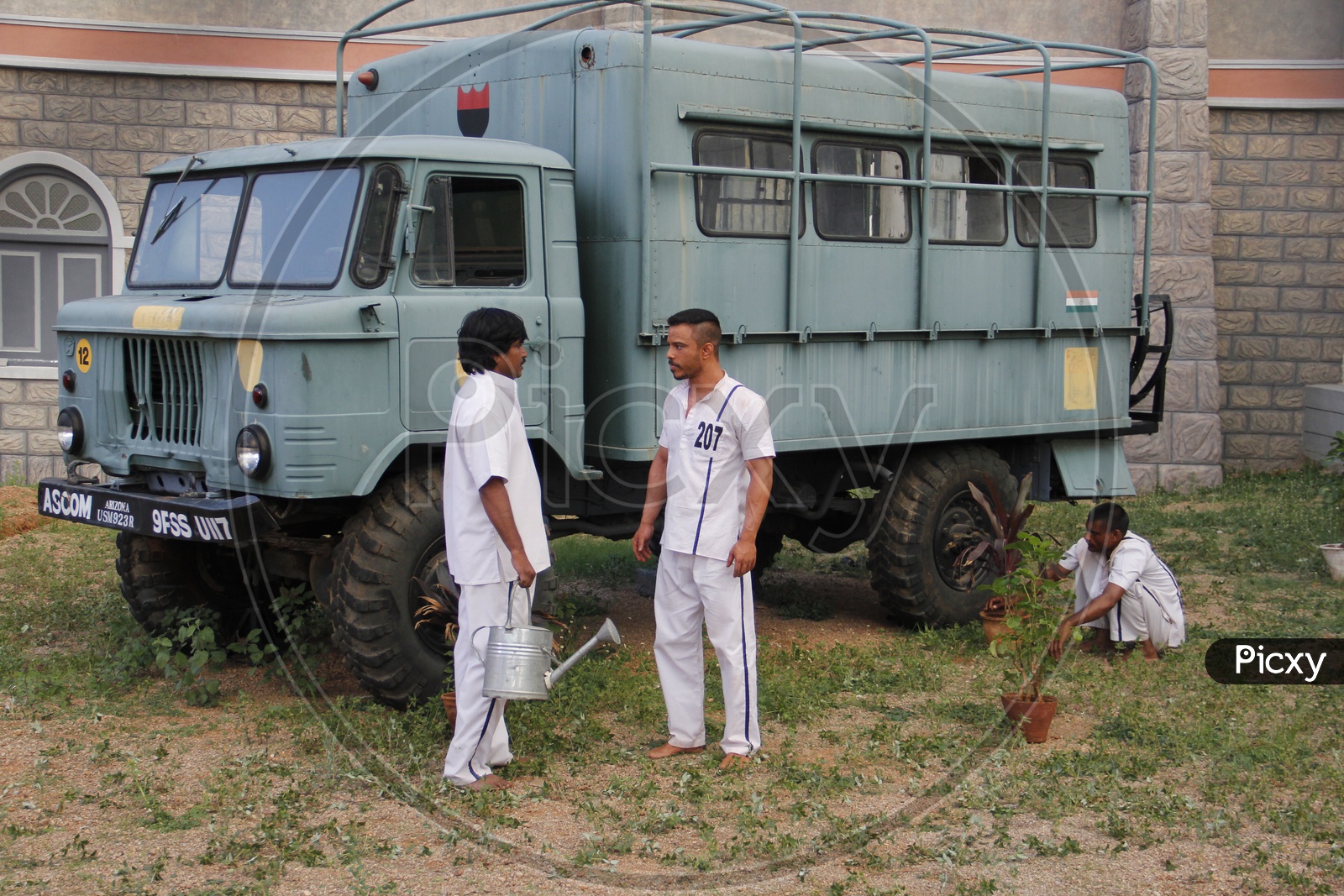 Image of Indian Male Prisoner in uniform gardening at Jail-KW409002-Picxy