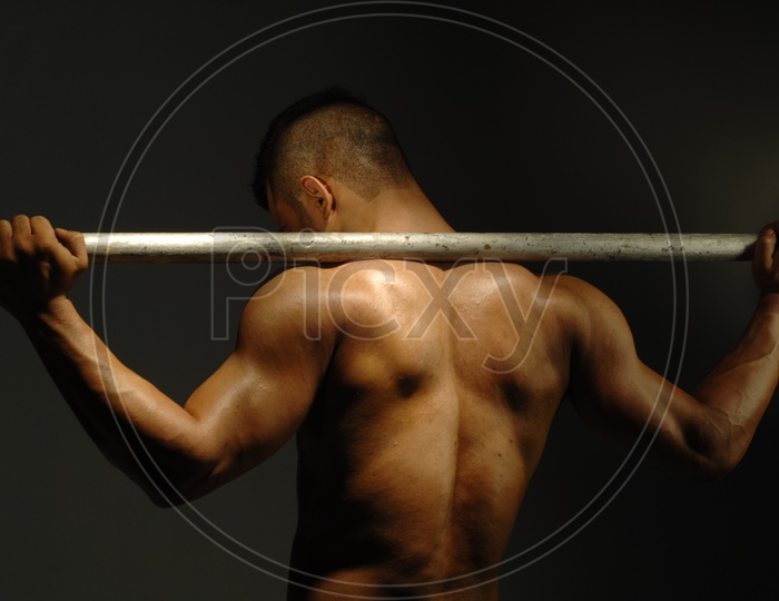 Image of Indian Muscular Man during a screentest with Ak-47-ZL963446-Picxy