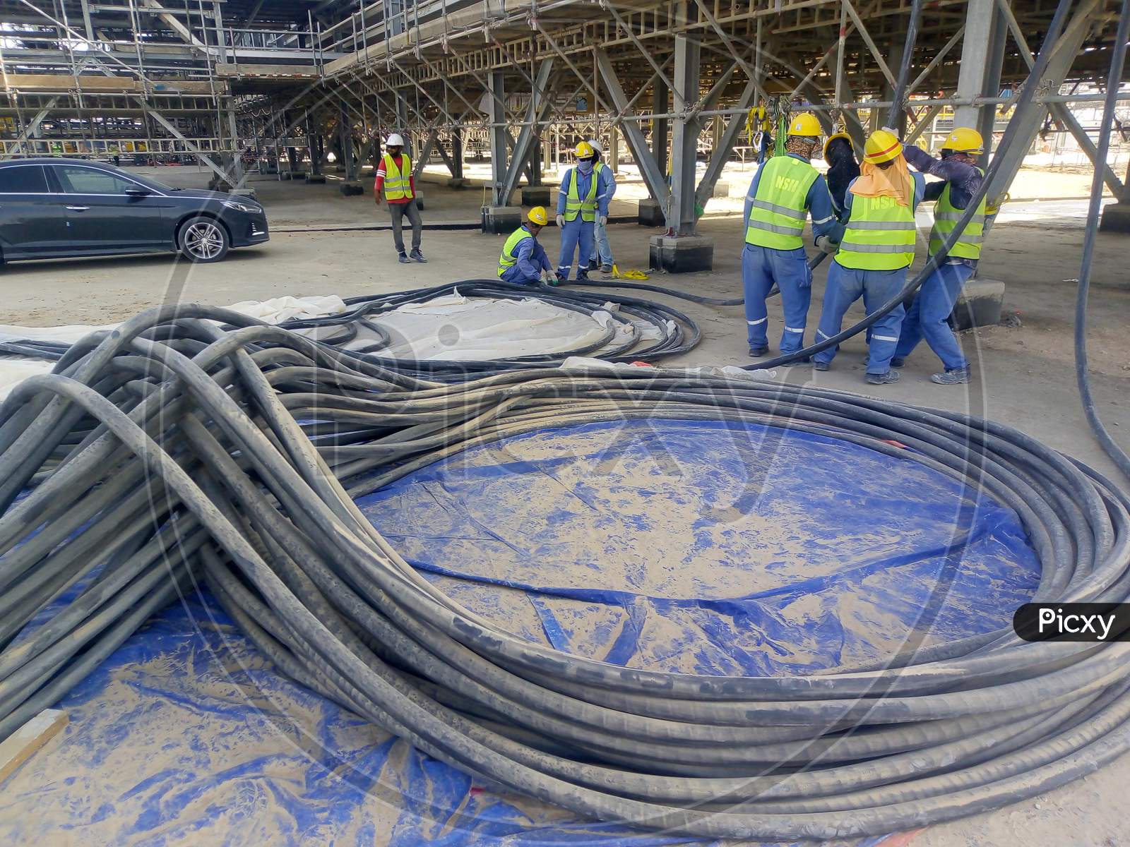 Image of Cable pulling labour work shift in cable tray-NM241955-Picxy