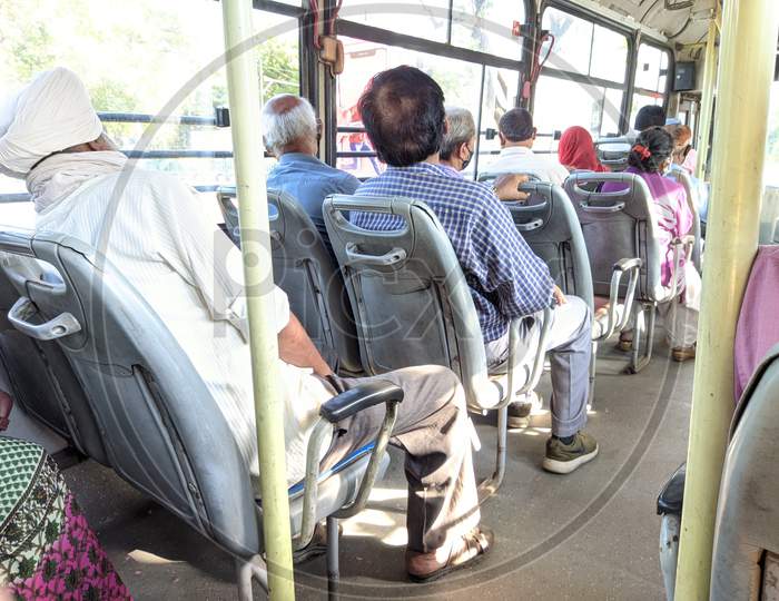 Image of Passengers riding in a commuter bus (Press Photograph ...