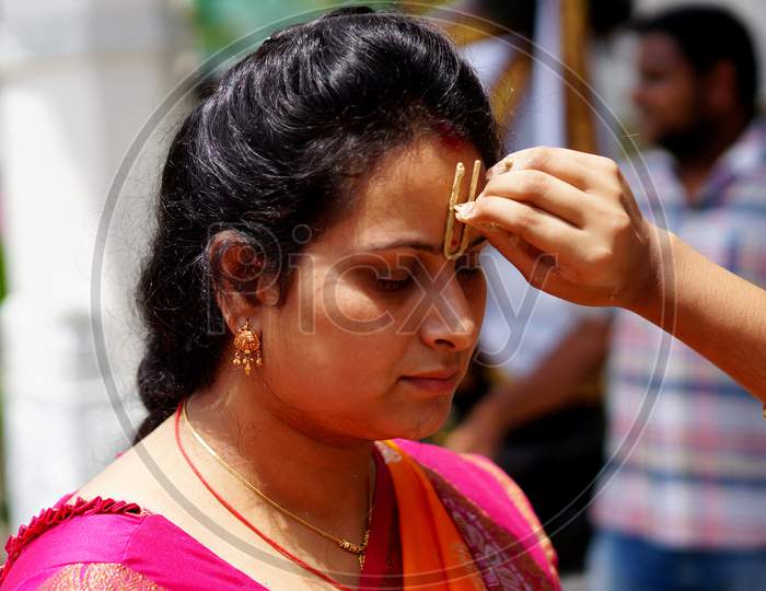 Image of Indian Hindu Woman Apply Tilak On Fore Head Of A Devotee,A ...