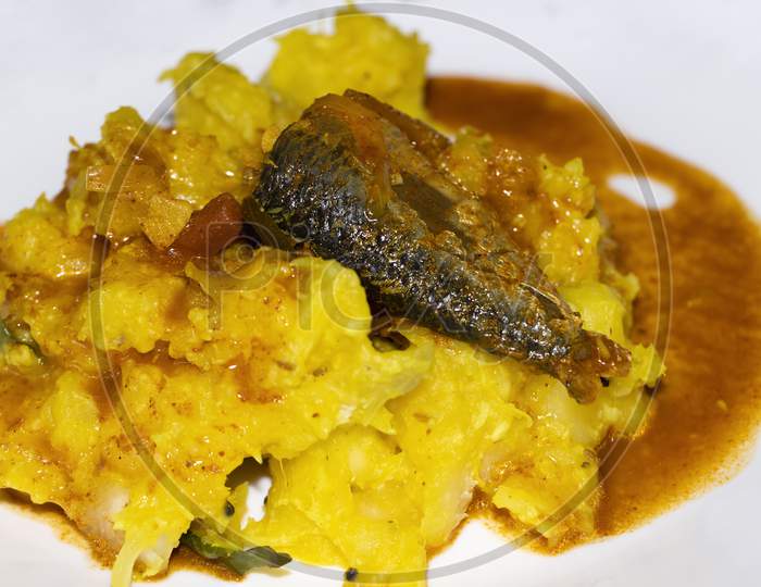 Image of Kerala Style Yellow Tapioca With Fish Curry In White ...