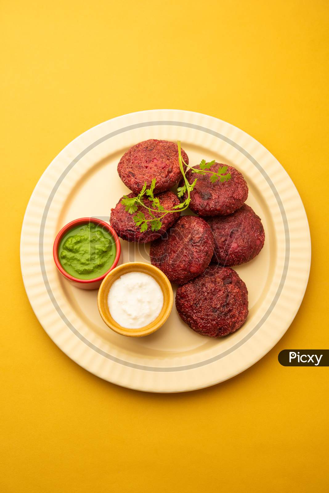 Image of Beet Root Patties Or Cutlet Or Tikki Served With Green Chutney ...