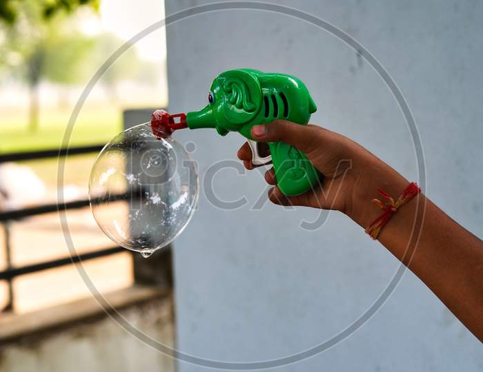Image of Portrait Of A Soap Bubble Blower In A Unidentified Kids Hand ...