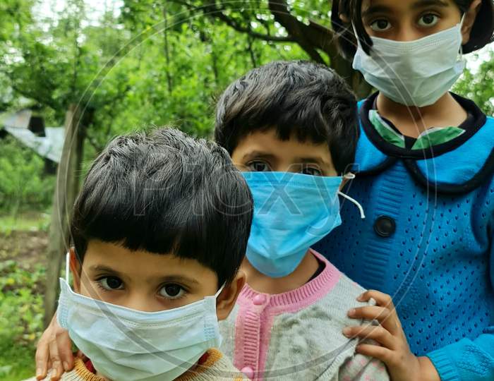 Image of Masked Children Looking Camera An Asian.-NL198314-Picxy