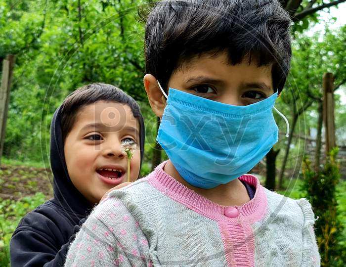 Image of Masked Children Looking Camera An Asian.-NL198314-Picxy