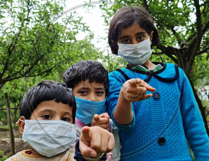 Image of Masked Children Looking Camera An Asian.-NL198314-Picxy