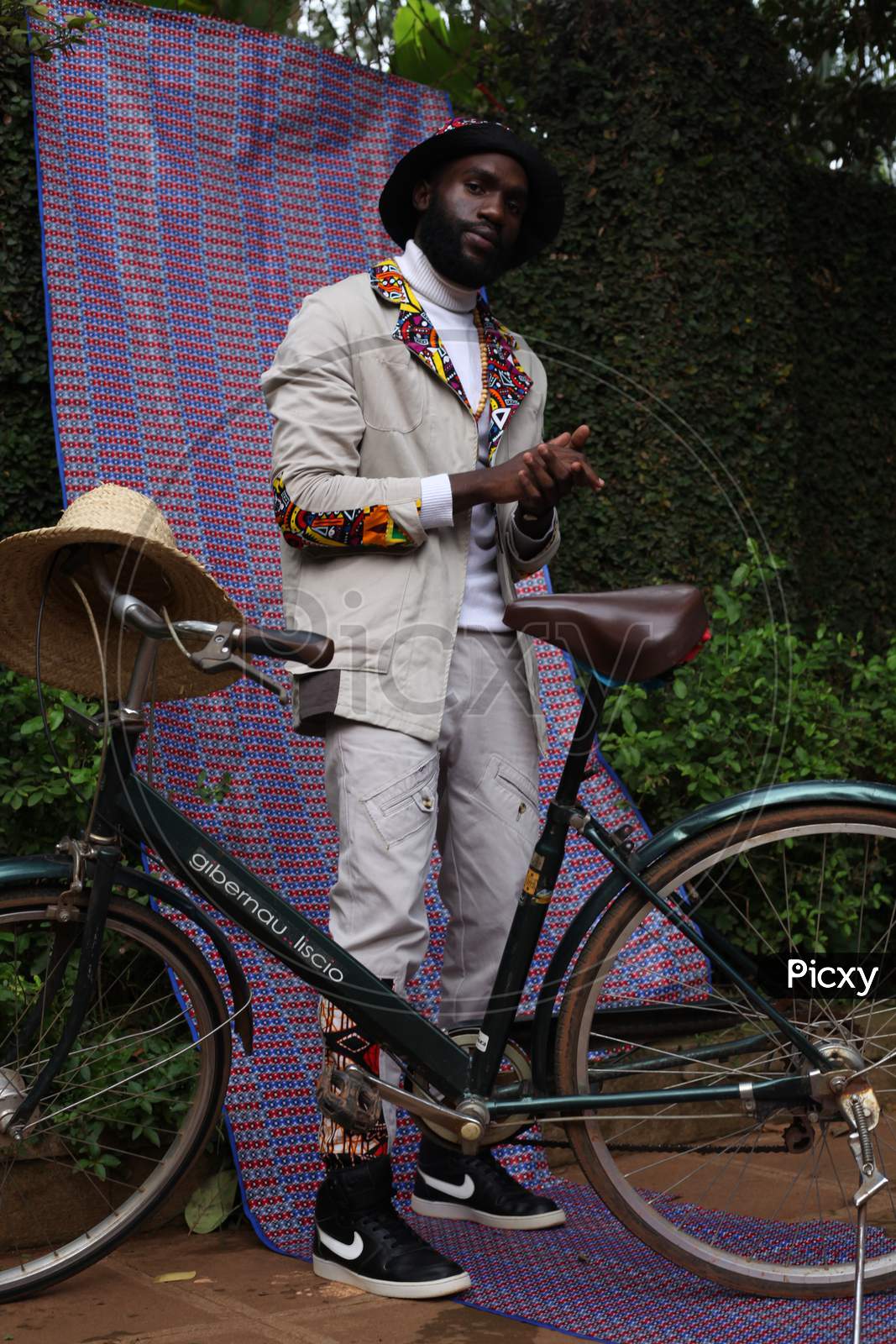Image of Creative Black African American man poses on the bicycle in ...