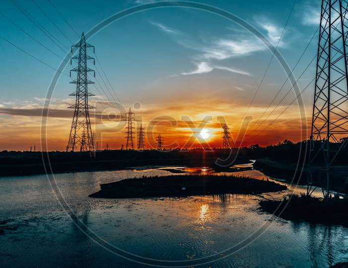 Image of Silhouette effect of high voltage electric towers with ...